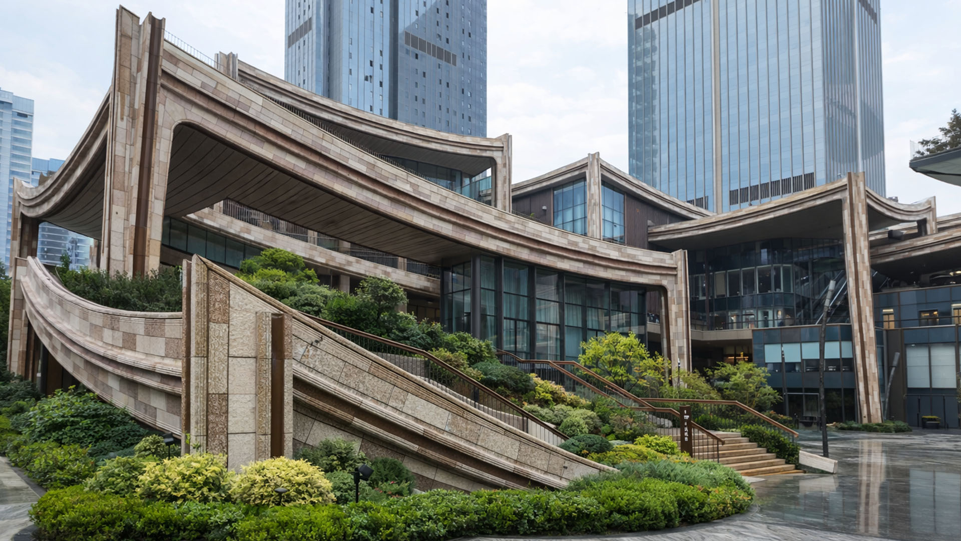 Green terraces wrap around this modern structure in China