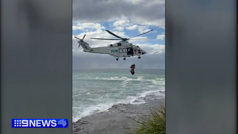 Daring rock fisher rescue as huge waves batter Sydney's beaches