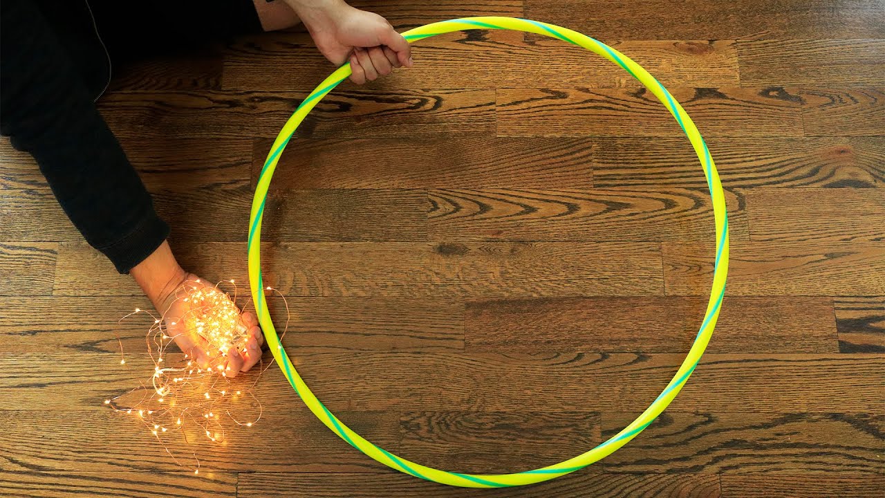 Wrap string light around a hula hoop for this gorgeous lighting idea!