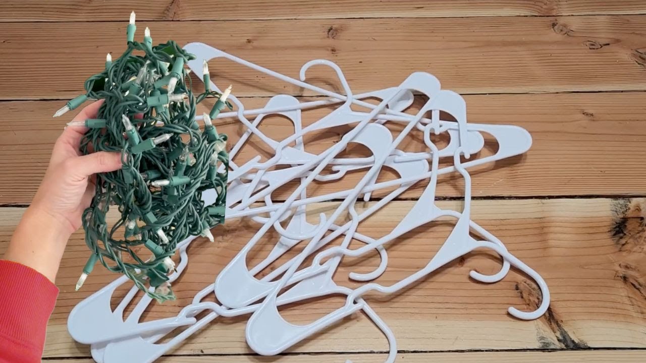 He wraps string lights around a hanger for this breathtaking idea!