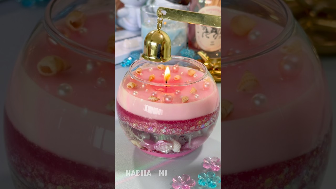 Pink water candle with seashells 🌸 so satisfying