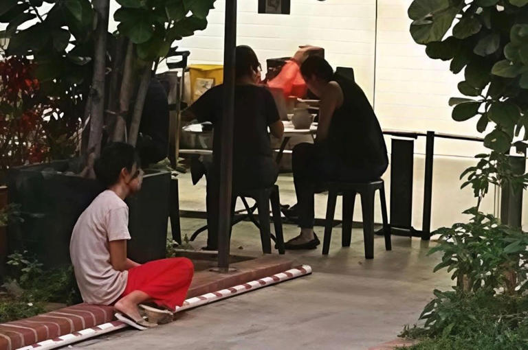 Photo of domestic helper on the ground while employers eat goes viral ...