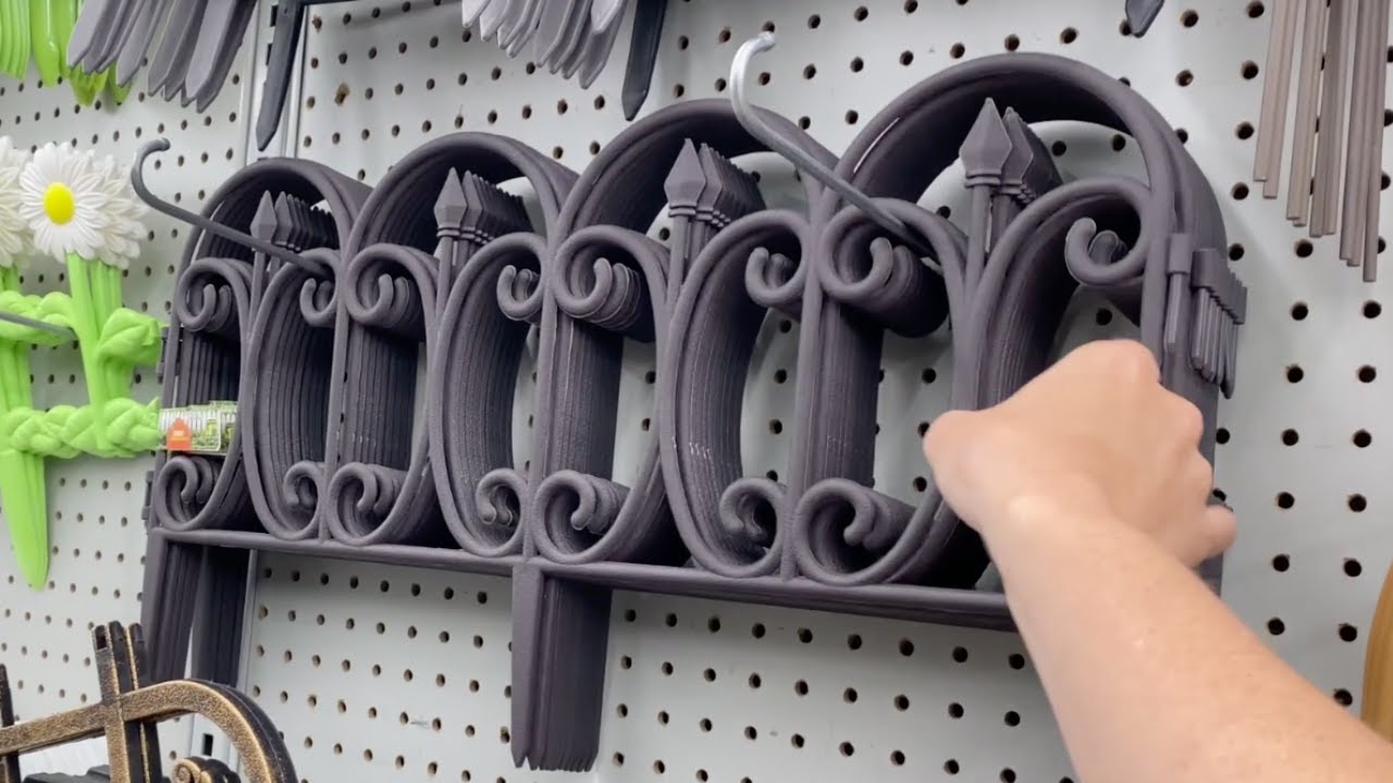 She hangs a dollar store fence from her ceiling... brilliant!