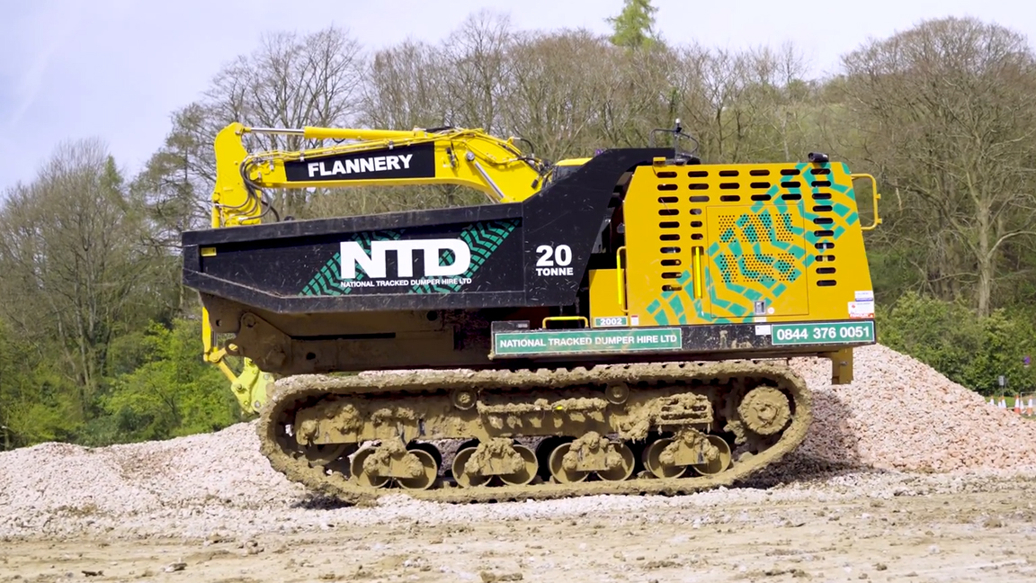 This machine carries heavy material across muddy terrain