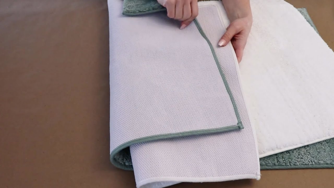 The brilliant way she uses 2 bathroom rugs to fake high-end decor ...