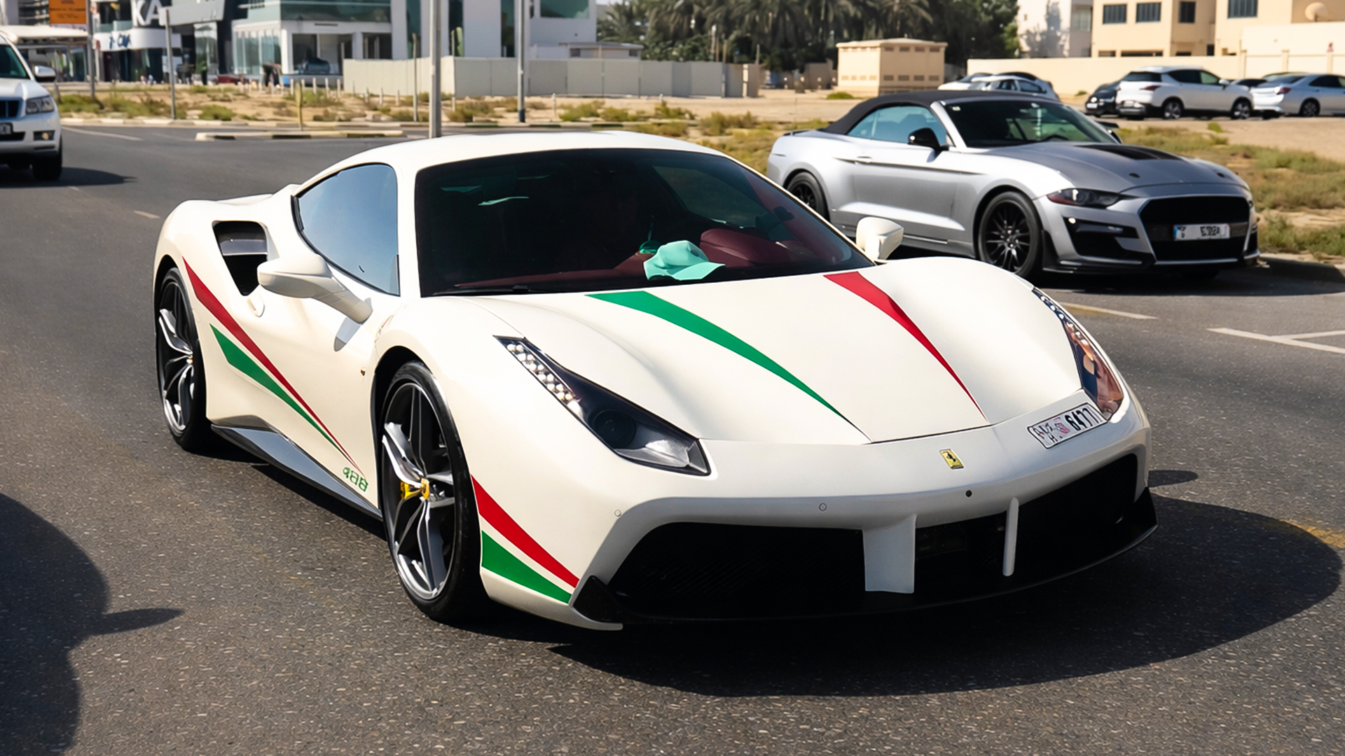 $300,000 Ferrari 488 Pista cruising in urban area
