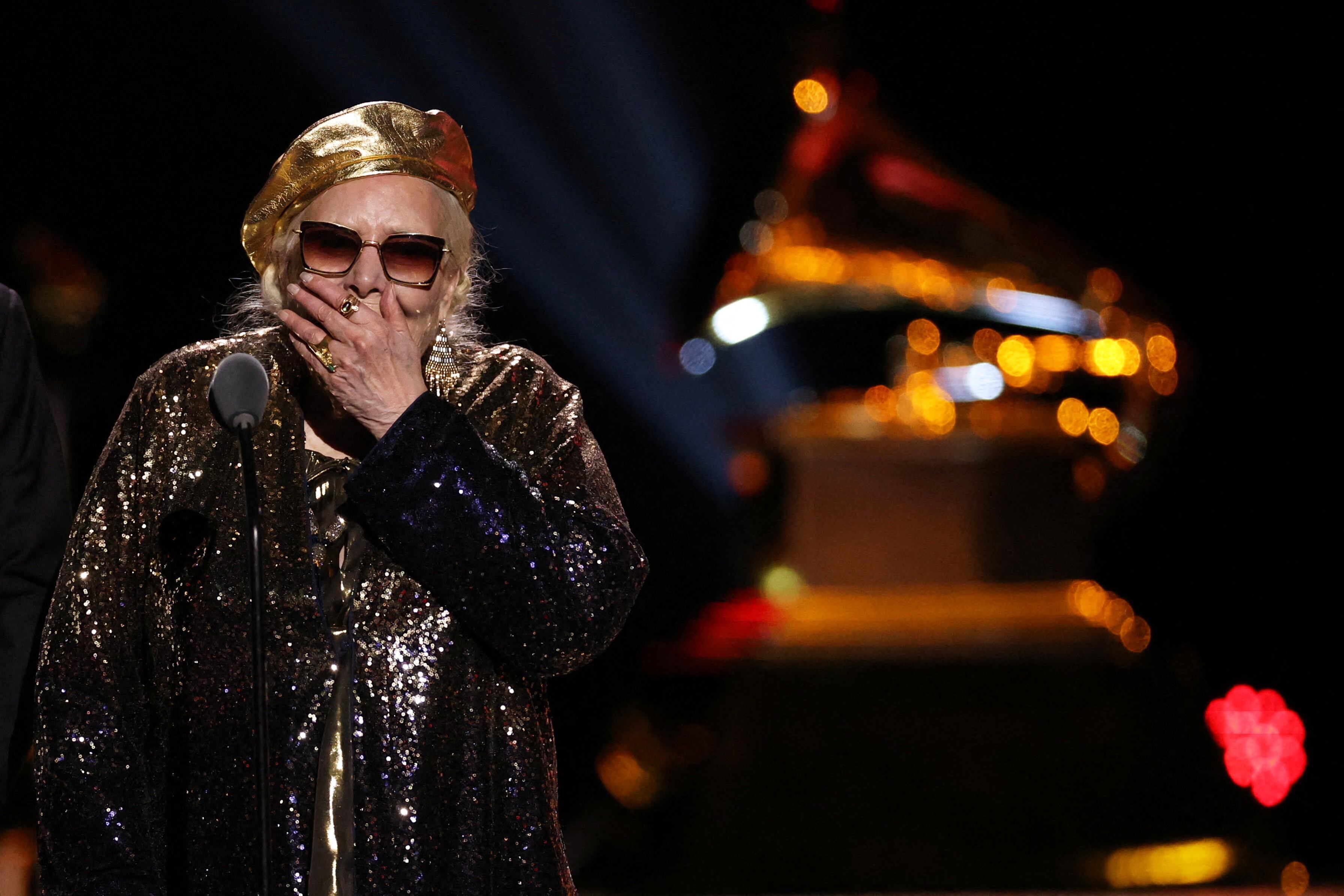 Reclusive singer, 82, steps out to bash Trump