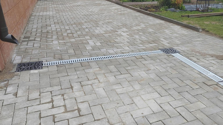 Puddles on your driveway are a warning sign you shouldn't ignore