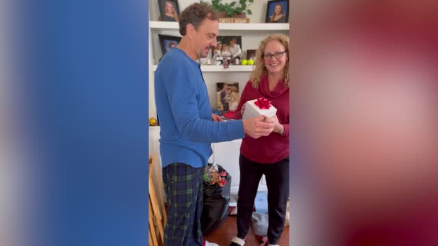 Couple announces impending grandparenthood with Christmas bauble reveal