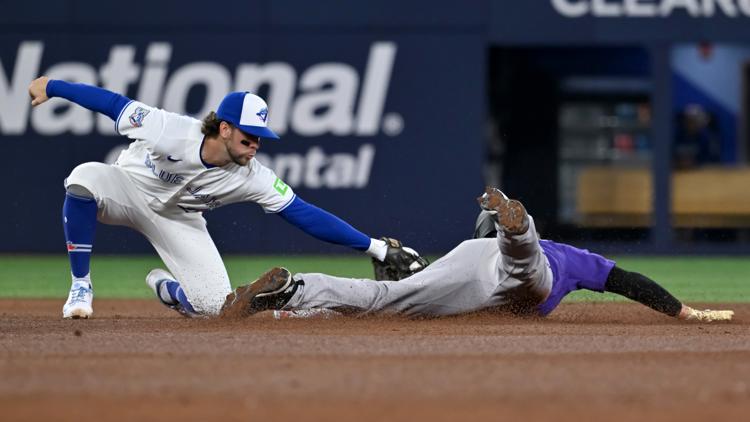 Rockies rout the Blue Jays 14-5 for their 1st win of the season