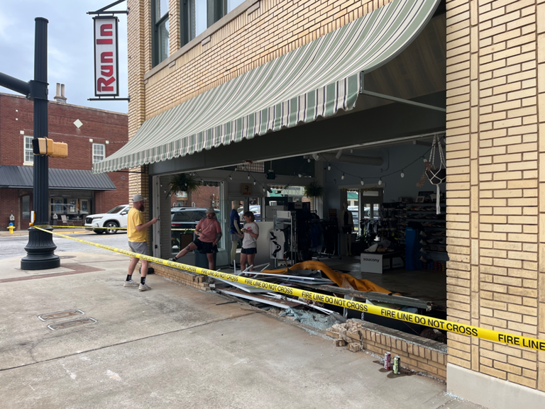 Car runs into Upstate running store