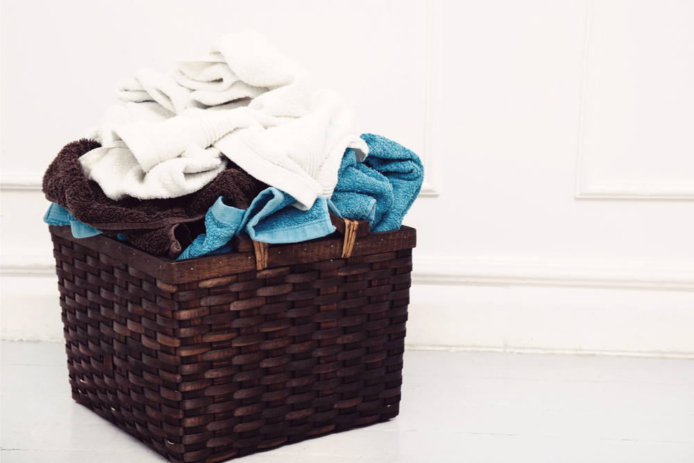 20 best solutions for storing dirty laundry in small home spaces