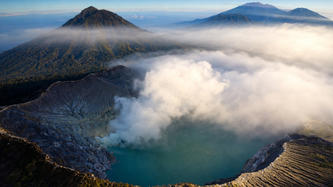 Volcanic crater releasing steam above a quiet mountain lake