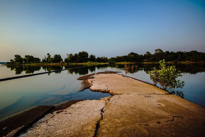 Oklahoma lake that used to stretch for miles now reveals mud flats