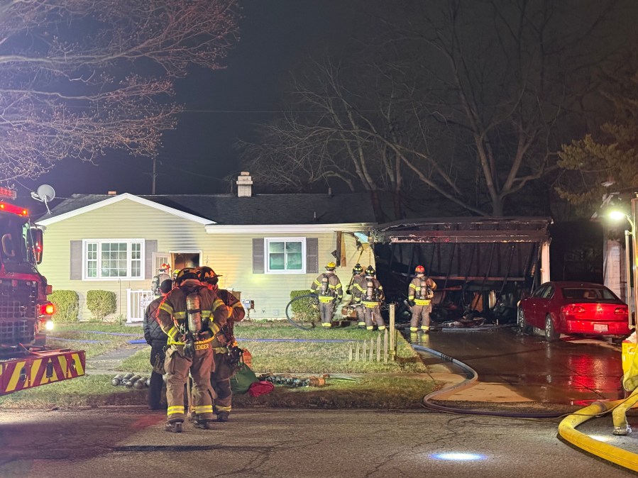 Fire crews respond to early morning house fire in Lansing