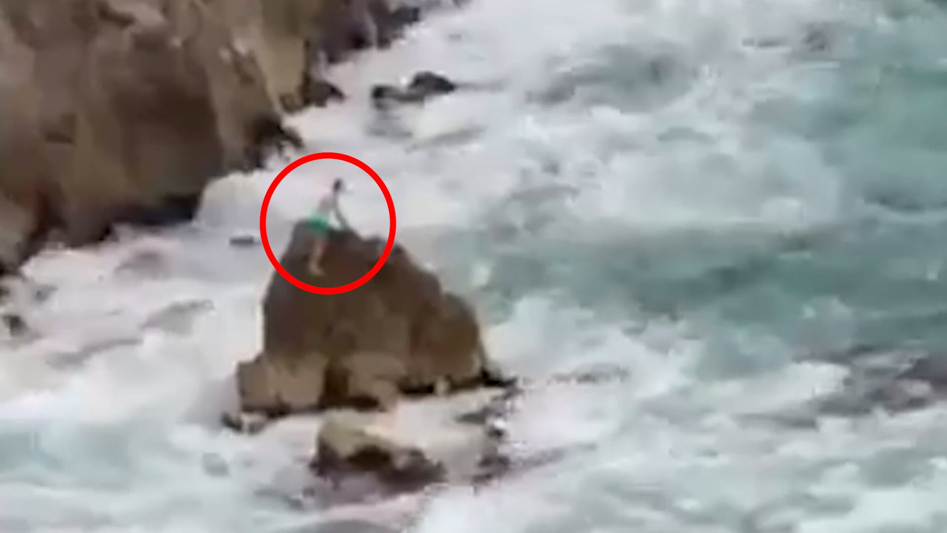 Swimmer stranded on rocks being battered by waves is rescued