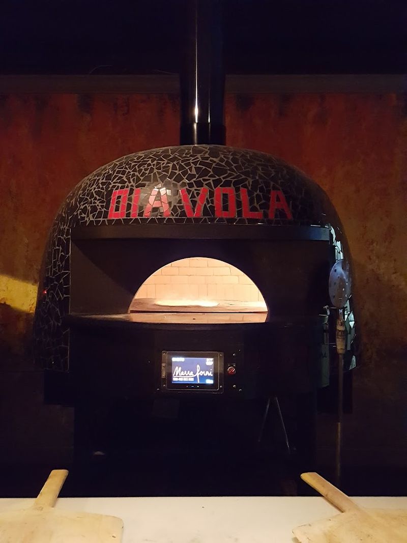 This artisan Indiana pizzeria uses a wood-fired oven to blister crusts ...