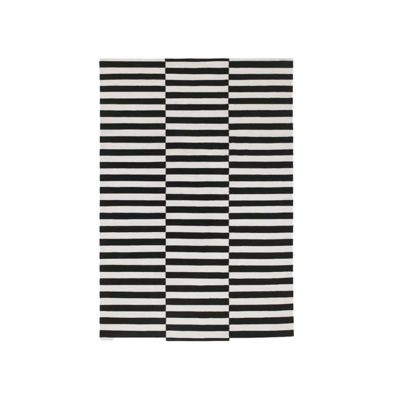 I never thought I'd put a rug on my wall - until I saw this DIY hack