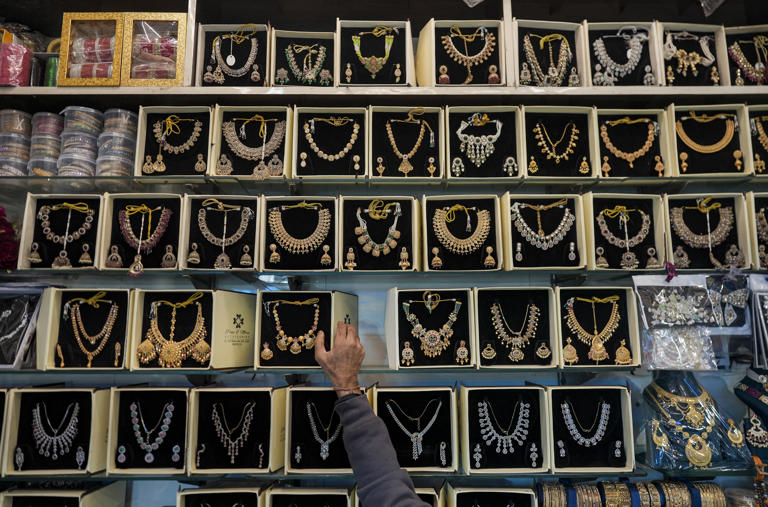Gold drops Rs 1,850 amid weak global cues; silver declines Rs 1,500