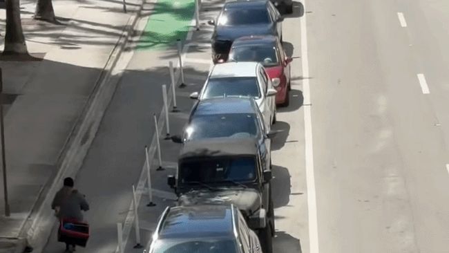 'Who's going to tell them?': Traffic jam ends in row of parked cars