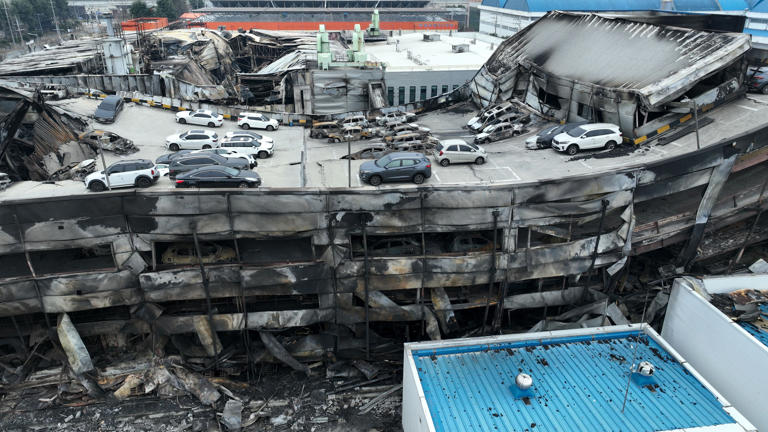 Families mourn Anjun industrial fire victims at memorial altar