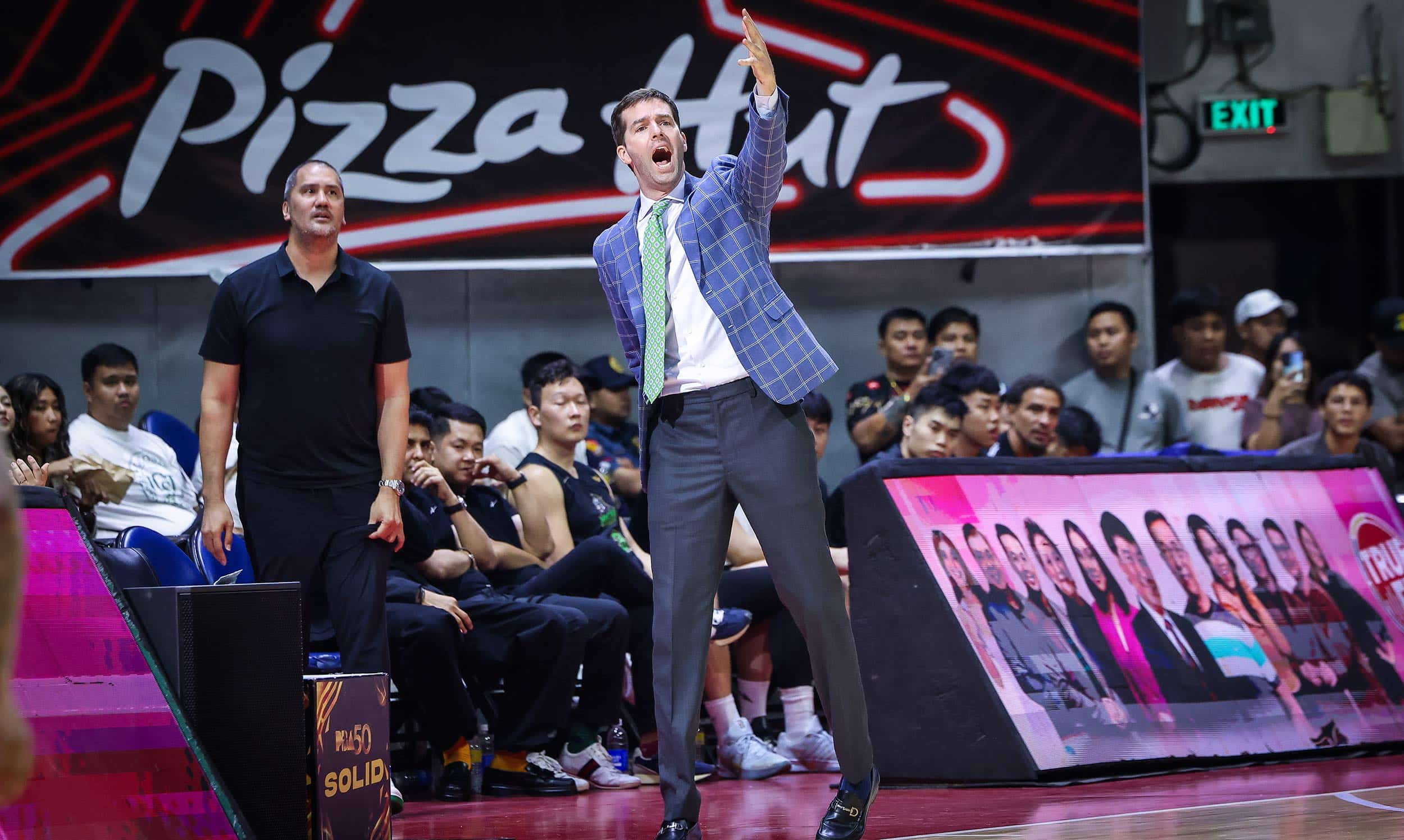 As coaches dress down, Garrett Kelly stays suited up with tradition
