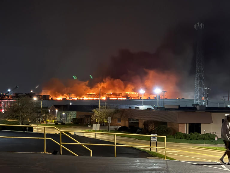 Flames, smoke seen from roof of Fuyao building