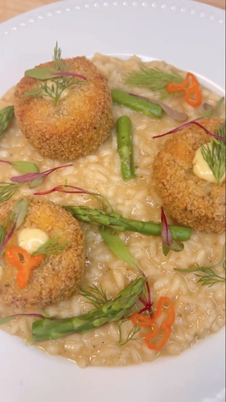 Breaded crab cakes on Dungeness crab risotto: ultimate seafood dish