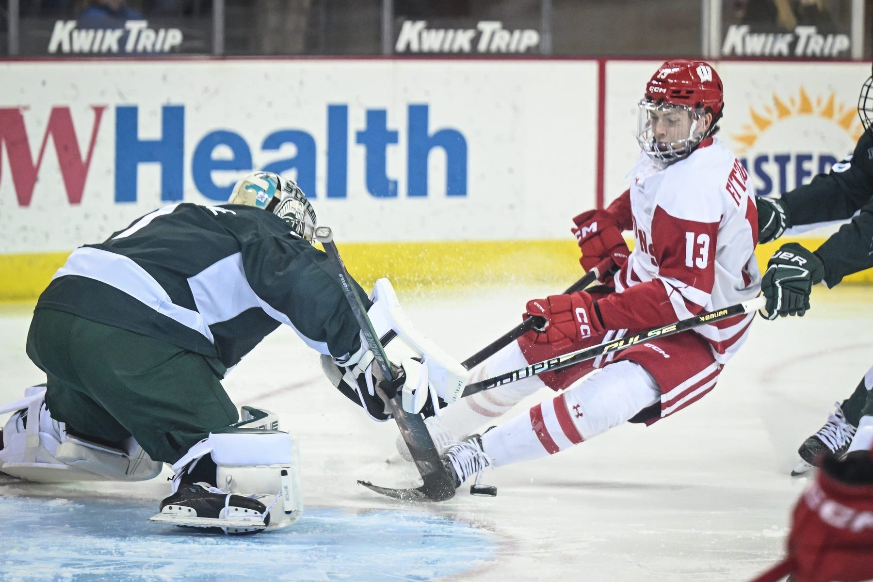 Who is the Wisconsin men's hockey team facing in the NCAA tournament?