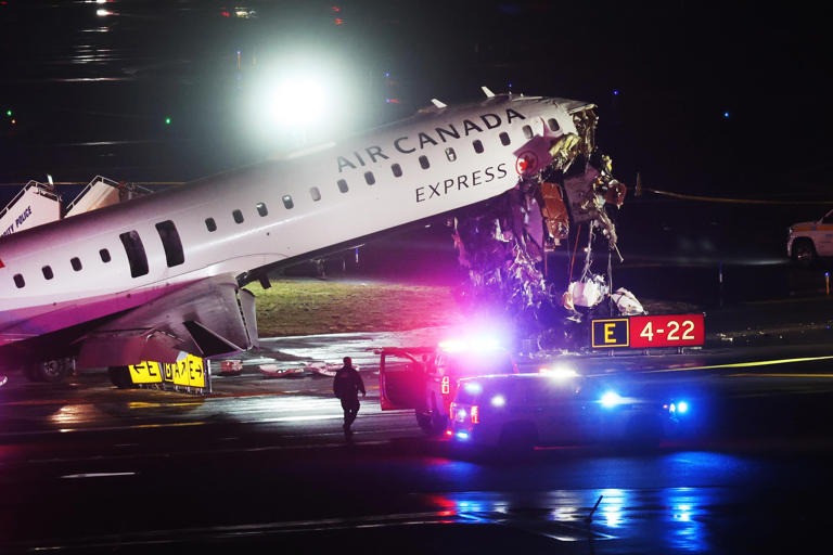 2 pilots killed as plane and fire-rescue truck collide at LaGuardia Airport