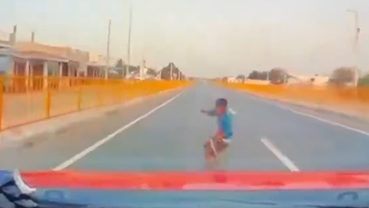 Boy struck by speeding car while crossing road, viral video leaves ...