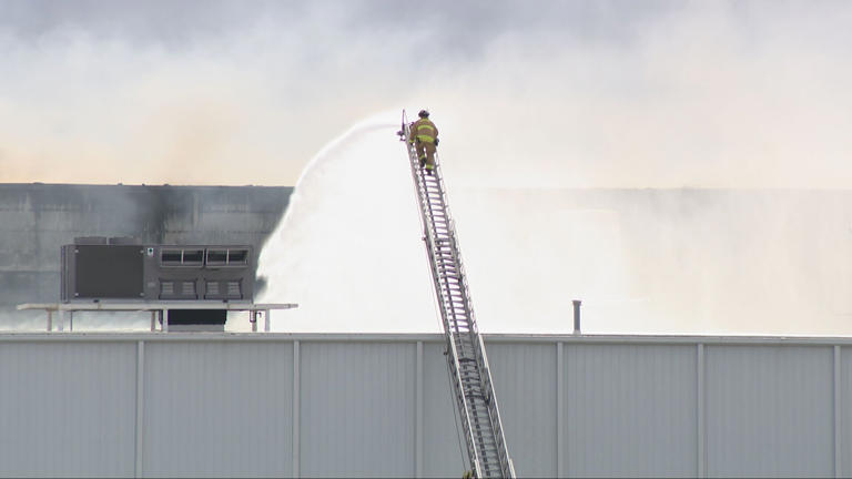 Fire and smoke still visible from roof of Fuyao Glass America facility