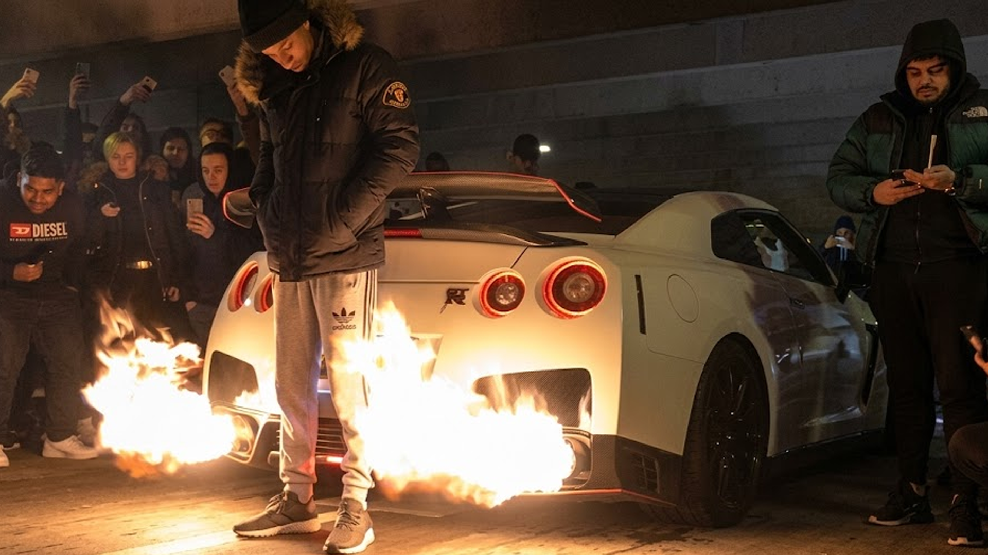 Night car meet with flaming supercars