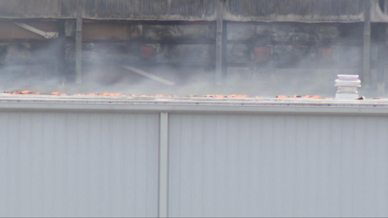Fire and smoke still visible from roof of Fuyao Glass America facility
