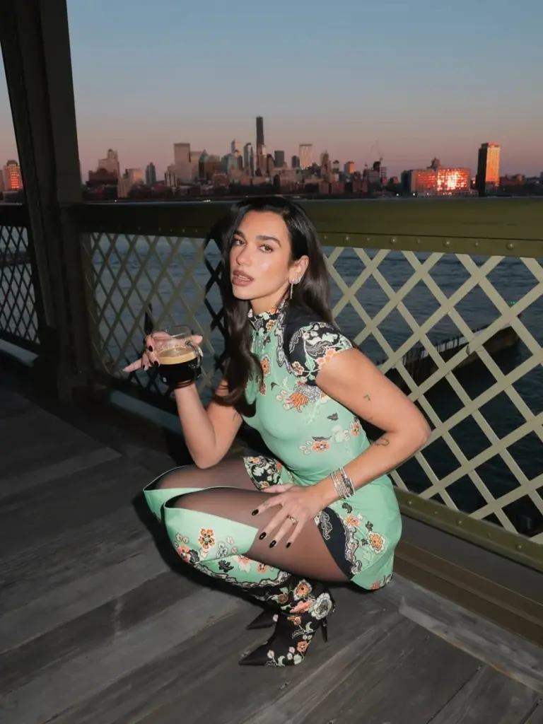 Dua Lipa dazzles in mint green mini dress, showing off long legs and ...