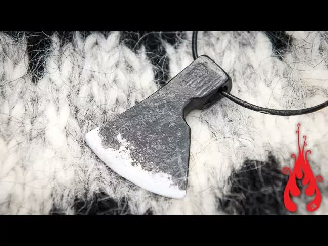 This tiny axe pendant was forged from steel