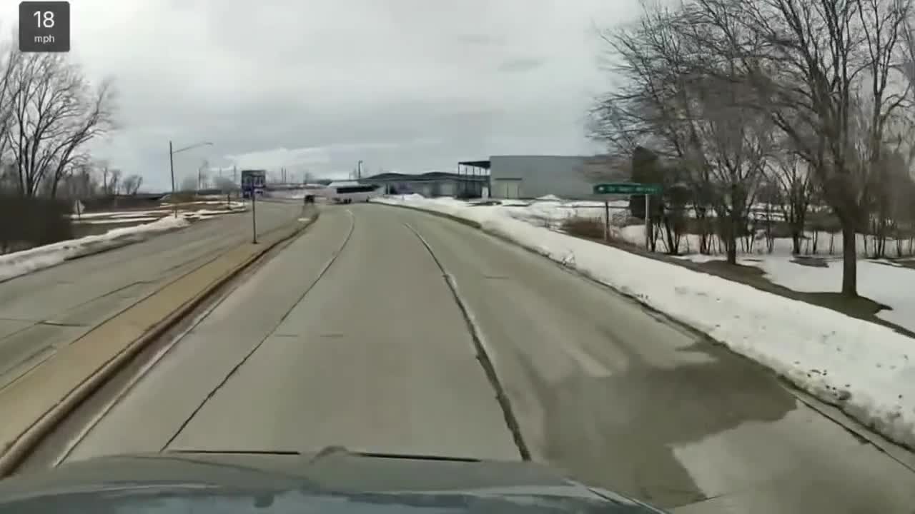 New dashcam video shows a charter bus crashing into a Green Bay warehouse
