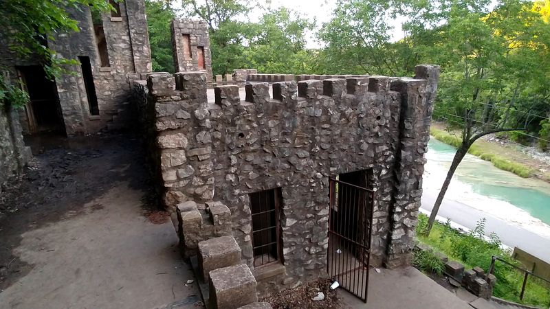 This mysterious castle by a roaring waterfall feels like a wonderland ...
