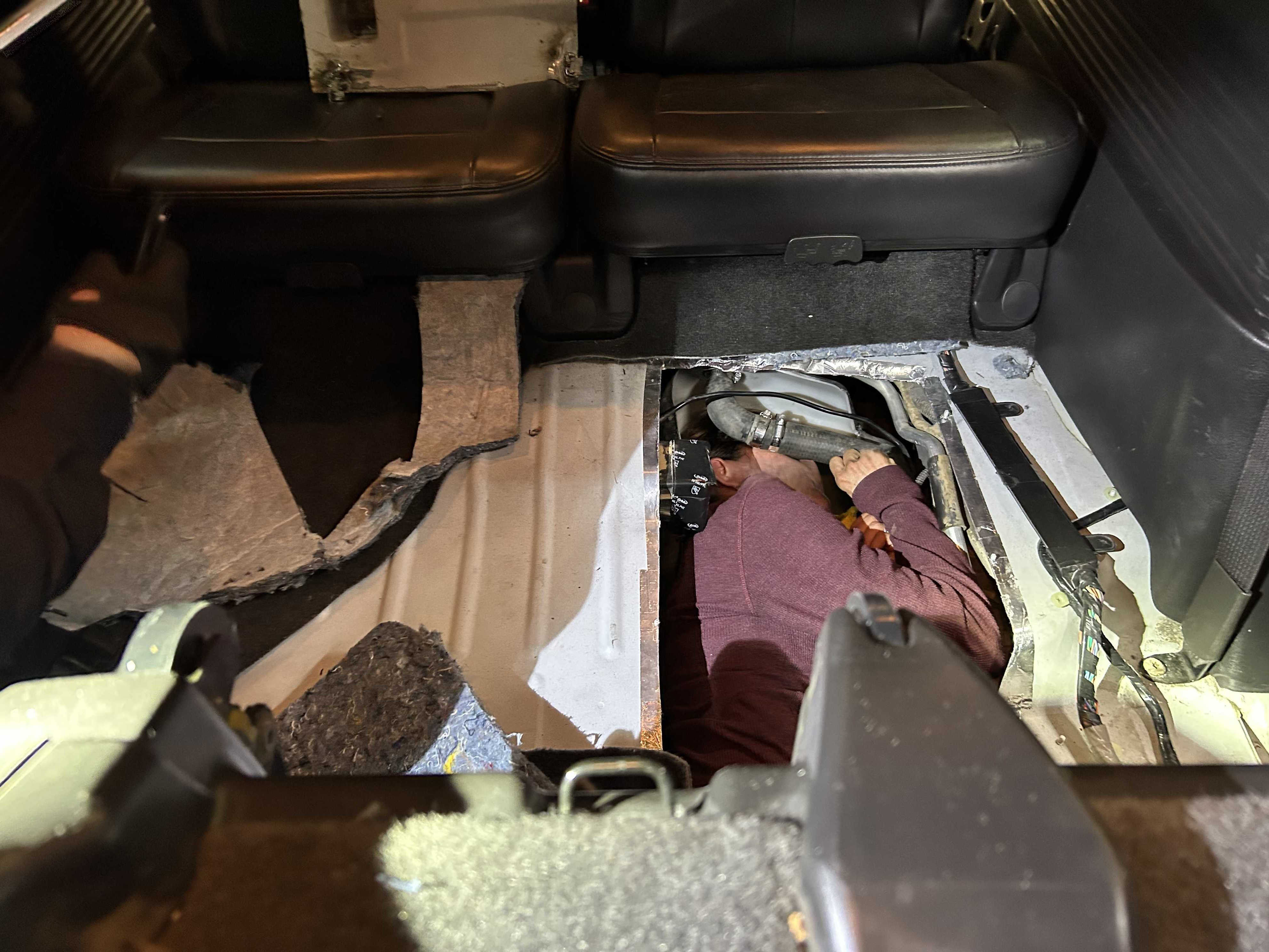Shocking image shows man hidden inside vehicle’s gas tank in attempted ...