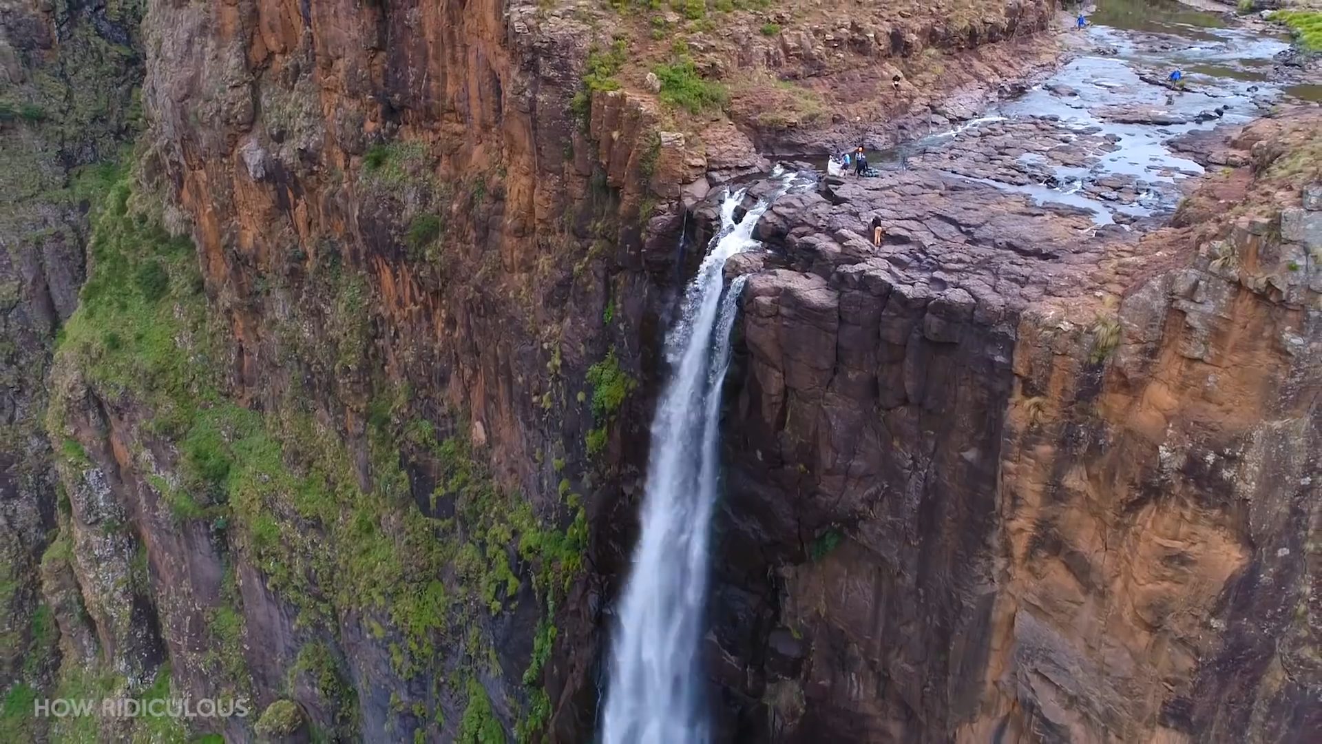 Watch what happens when 100 basketballs fall down a 650 ft waterfall