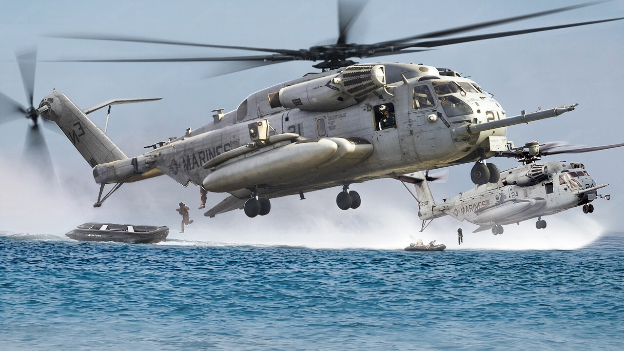 US special forces jump into water from massive CH-53 helicopters