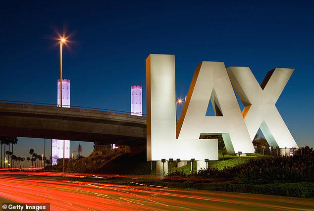 Traveler astonished as LAX baggage handler seen carelessly throwing ...