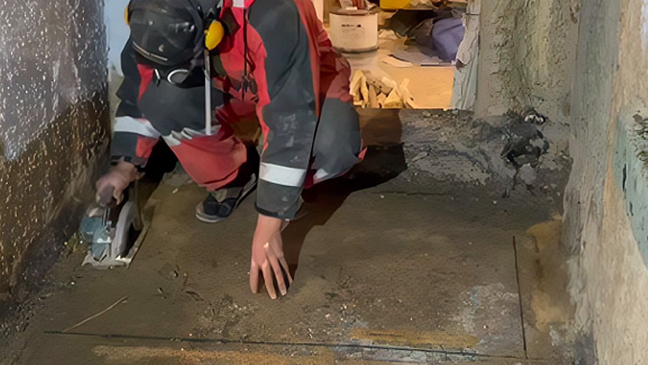 Construction worker cuts hole around himself