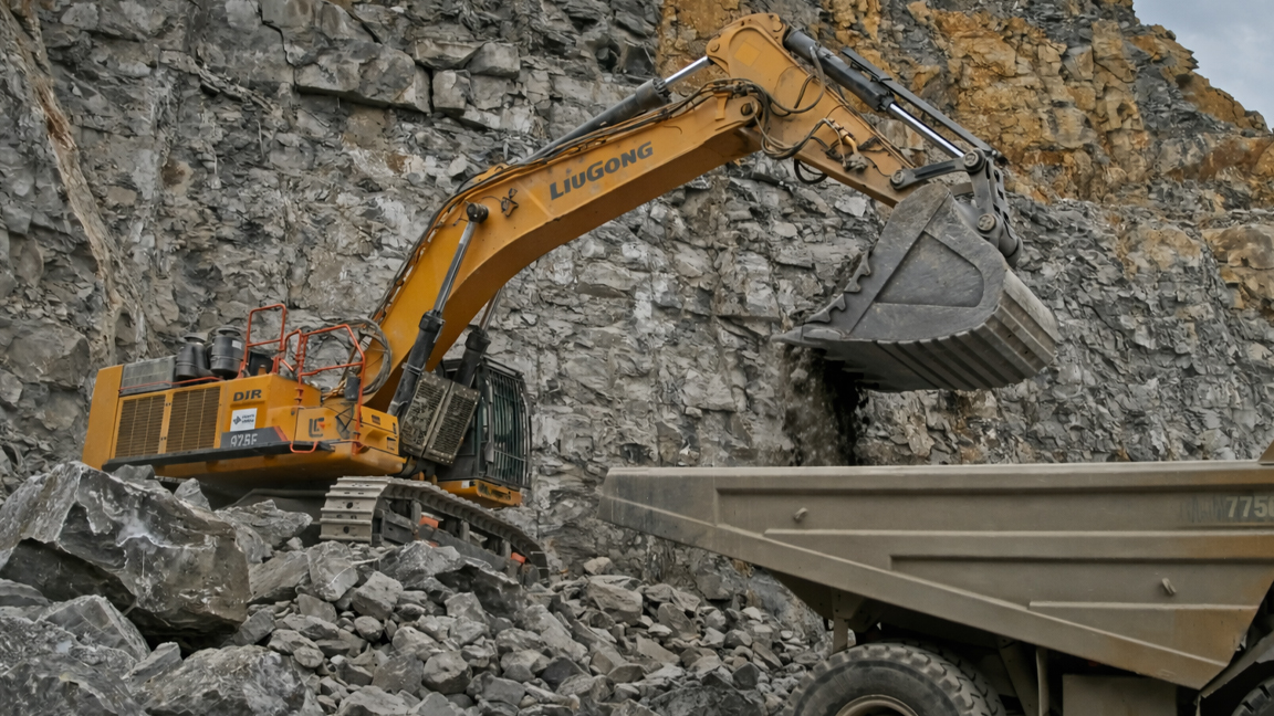 Powerful machine crushing and loading rocks with ease