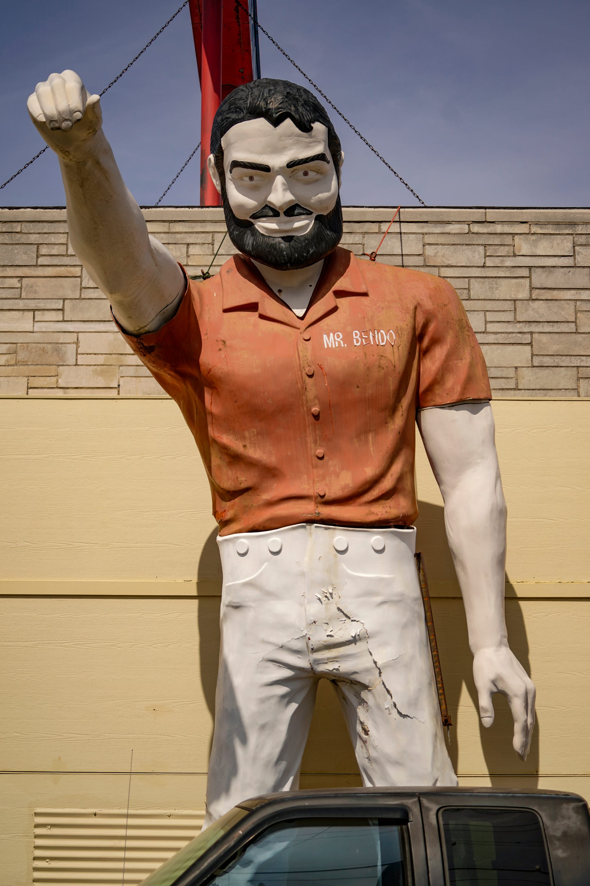 Mr. Bendo statue damaged in collision with car. What's his prognosis?