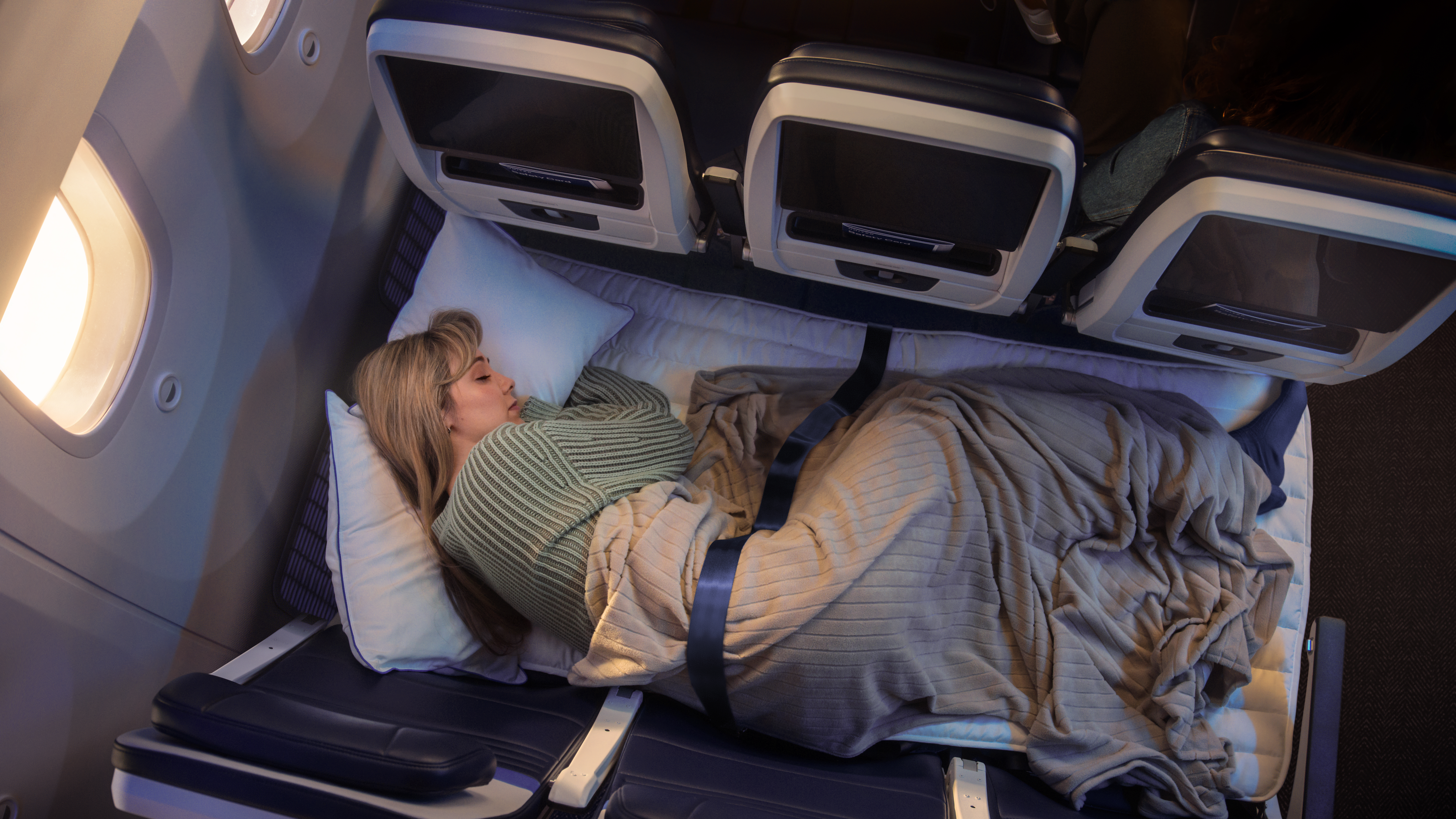 United Airlines debuts 'Relax Row' turning seats into a couch in ...