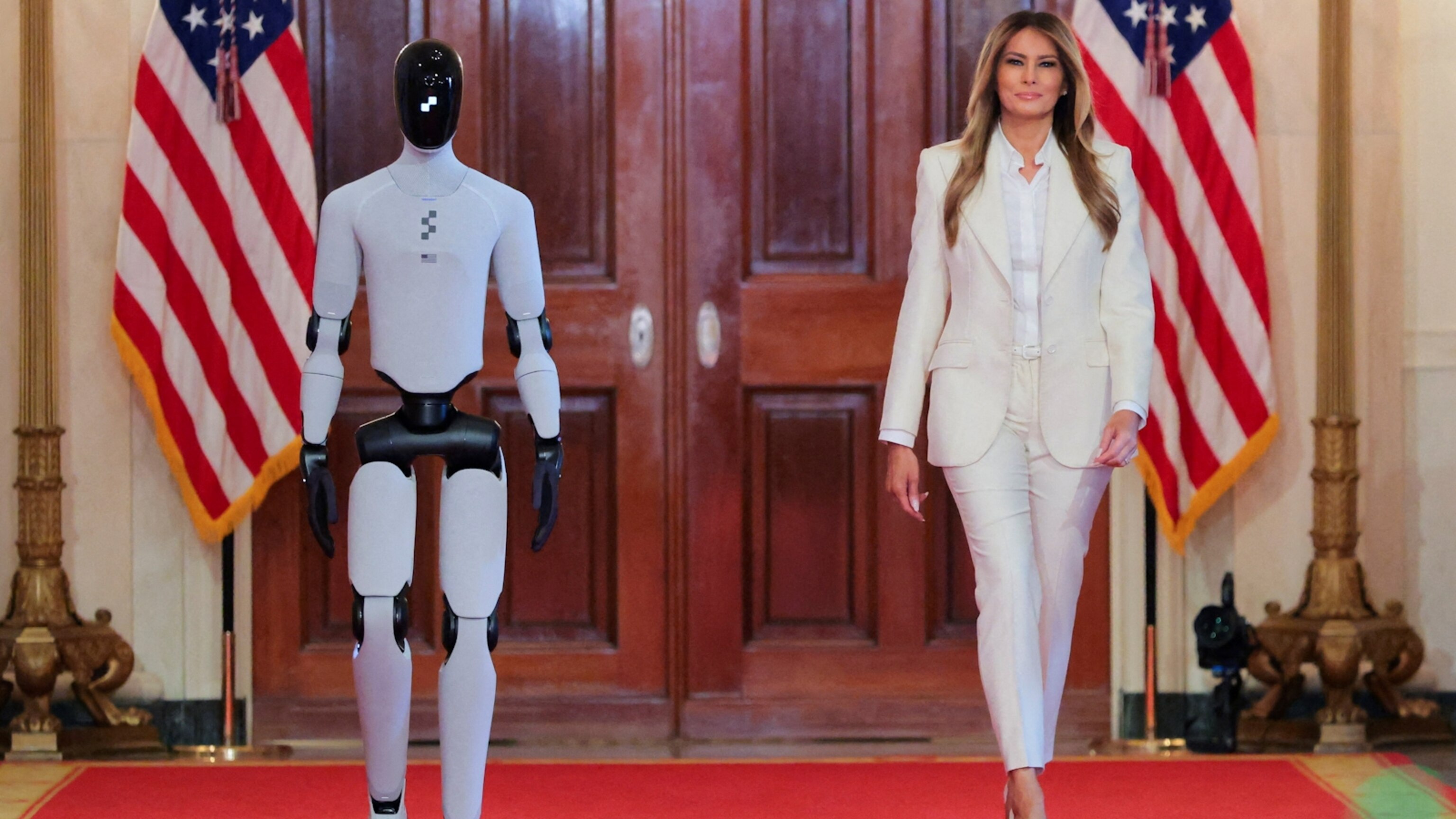 Melania Trump showcases robot guest at WH summit