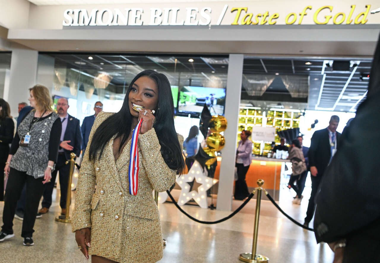 Simone Biles opens 'Taste of Gold' restaurant at Bush Airport during ...