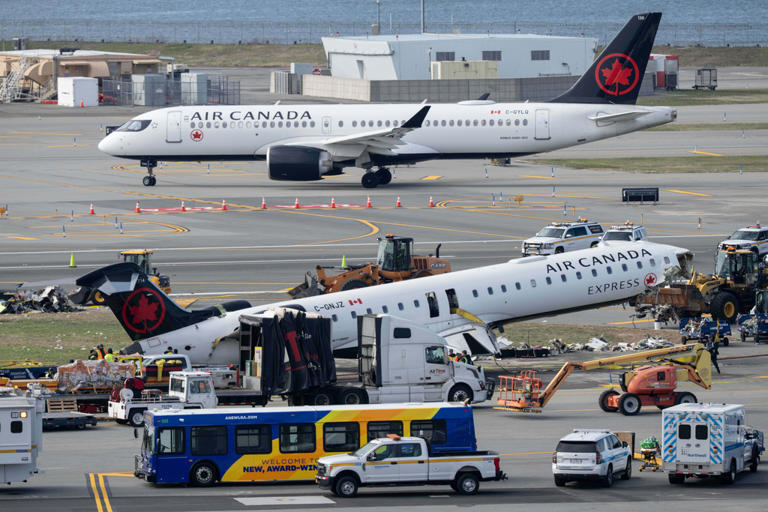 Mangled plane in LaGuardia crash is towed from runway as most injured ...