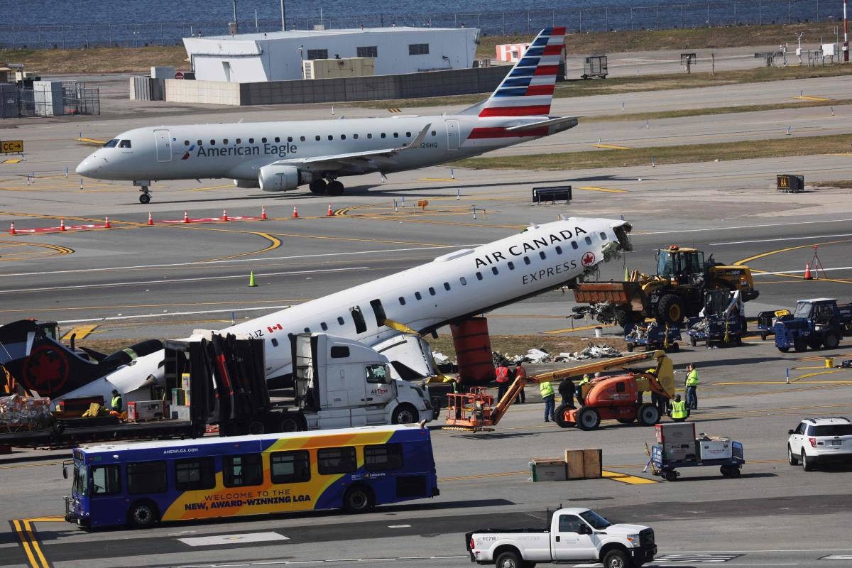 Mangled plane in LaGuardia crash is towed from runway as most injured ...